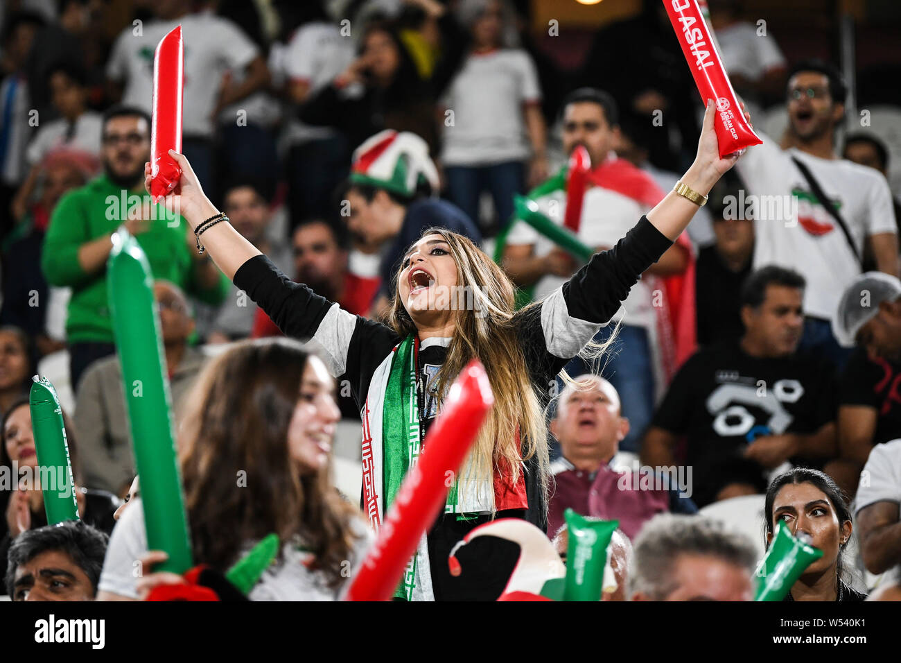 Iran fans wave slogans and national flags to show support to Iran ...