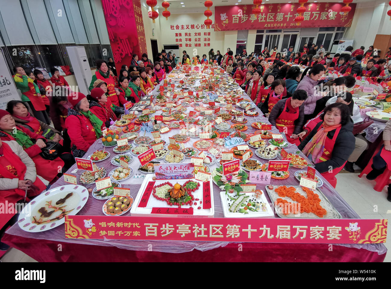 Hundreds of local residents enjoy the community cooking feast on the ...