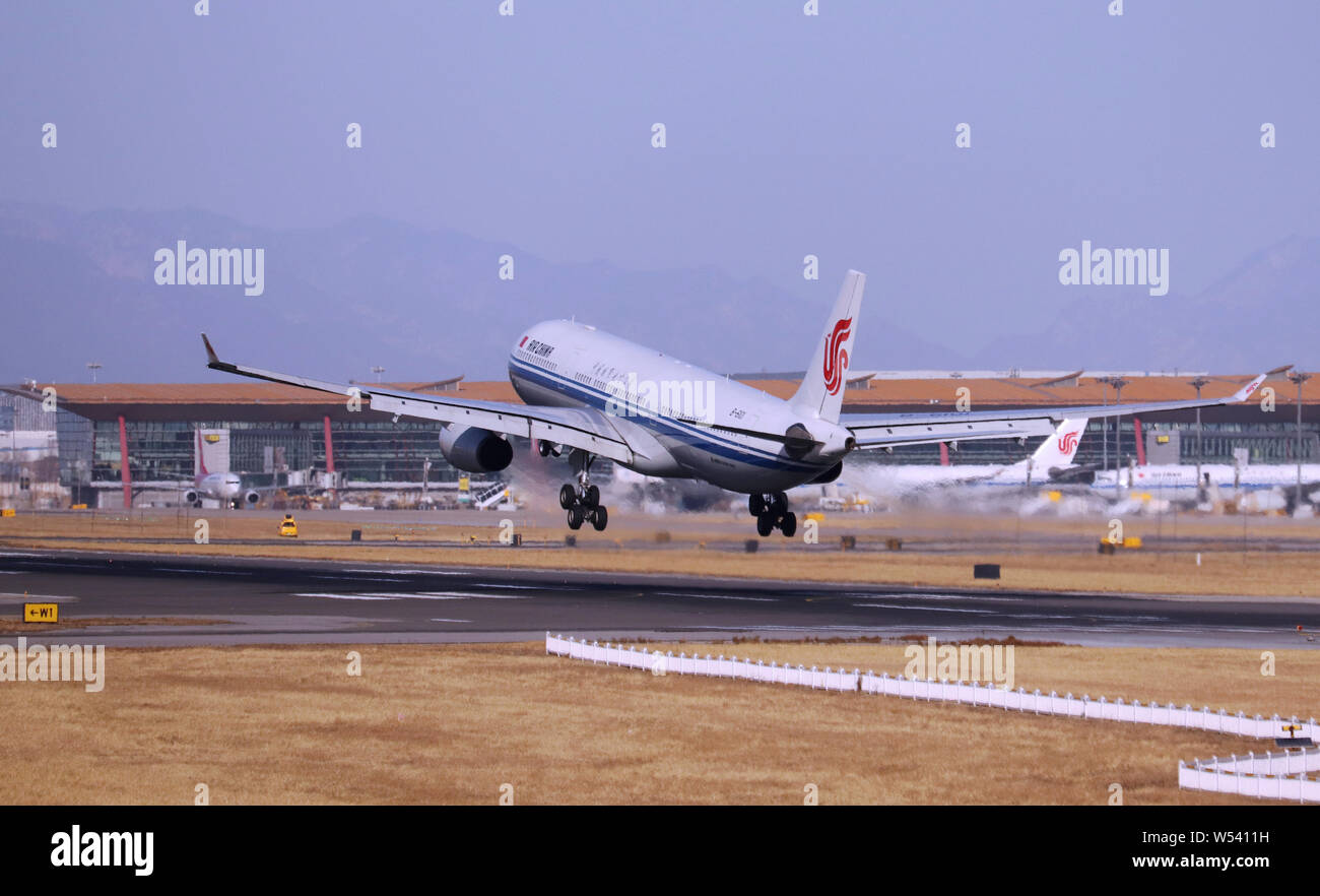 --FILE--A jet plane of Air China takes off at the Beijing Capital ...