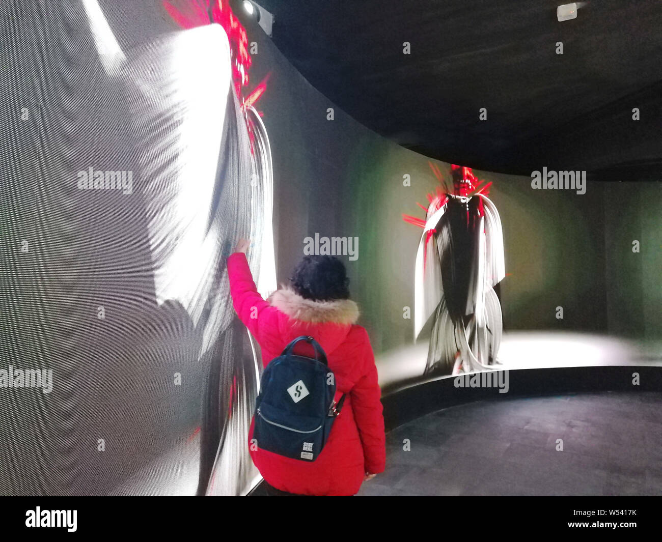 People visit the immersive digital experience exhibition at the Palace ...