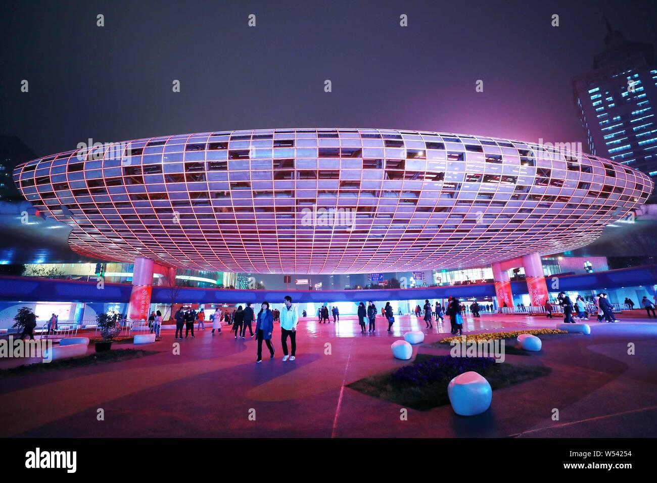 The giant egg-shaped structure is illuminated by colorful lights at an ...