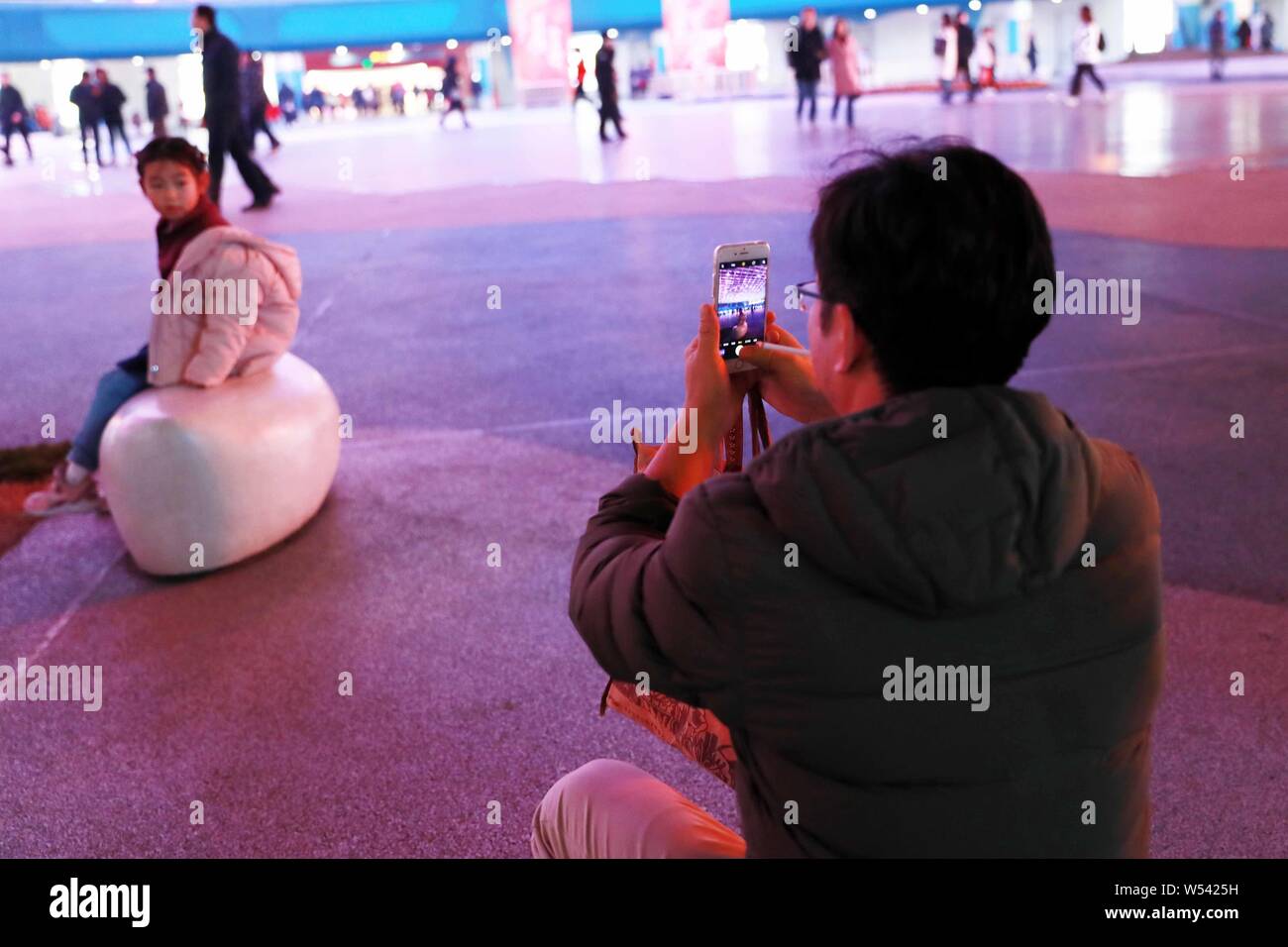 The giant egg-shaped structure is illuminated by colorful lights at an ...