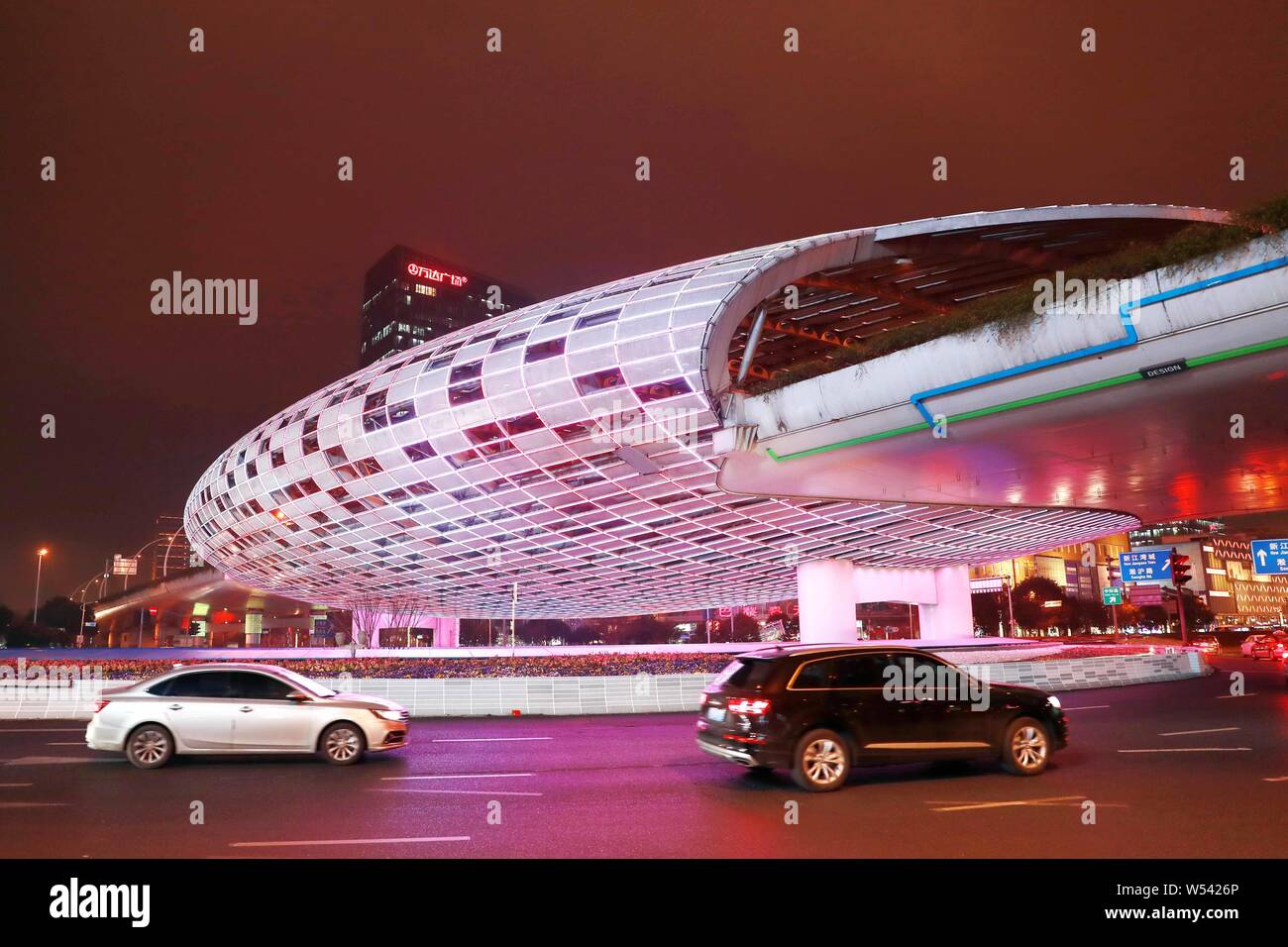 The giant egg-shaped structure is illuminated by colorful lights at an ...