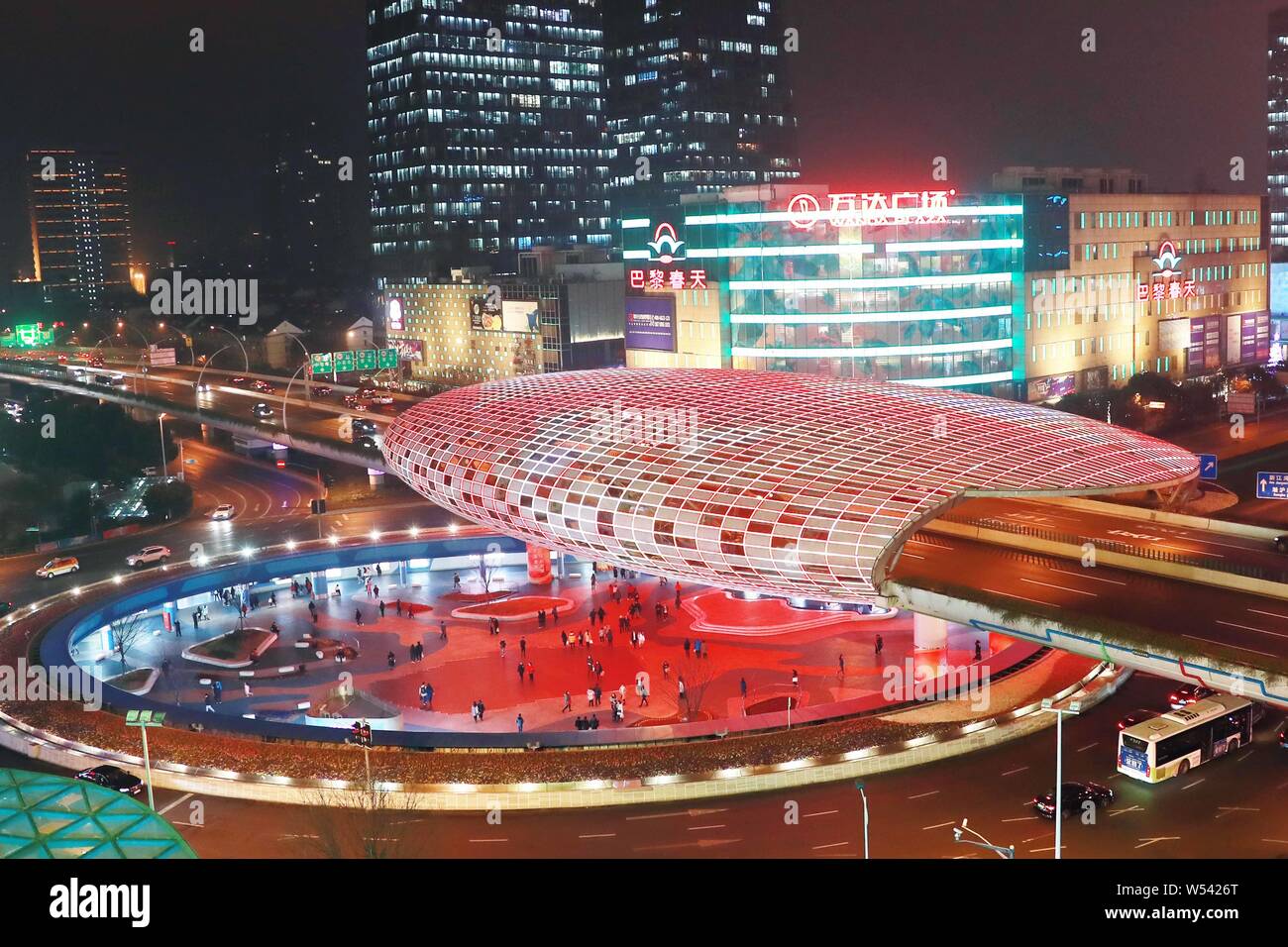The giant egg-shaped structure is illuminated by colorful lights at an ...