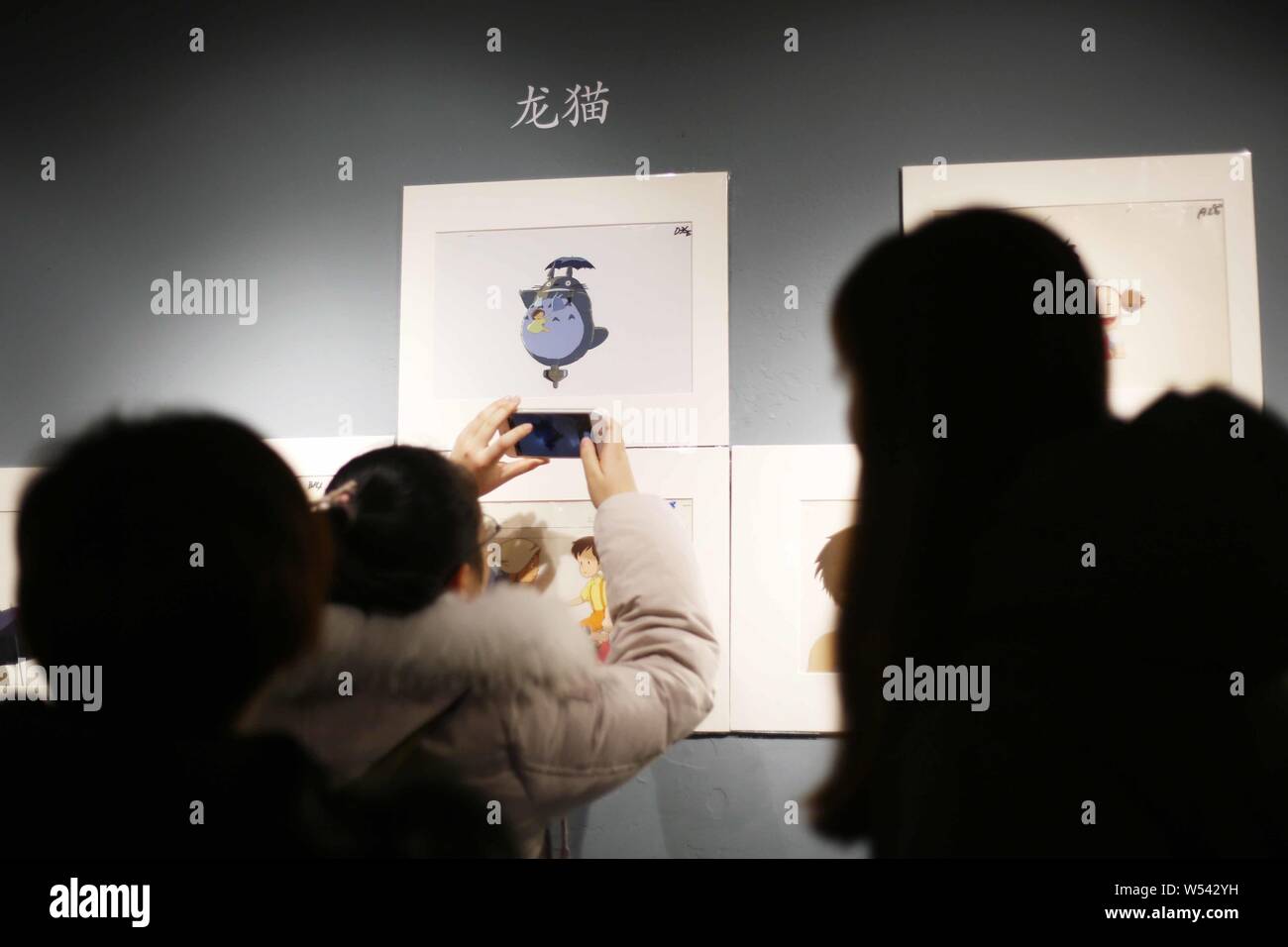 A visitor takes photos of manuscripts of Japanese animated film My ...