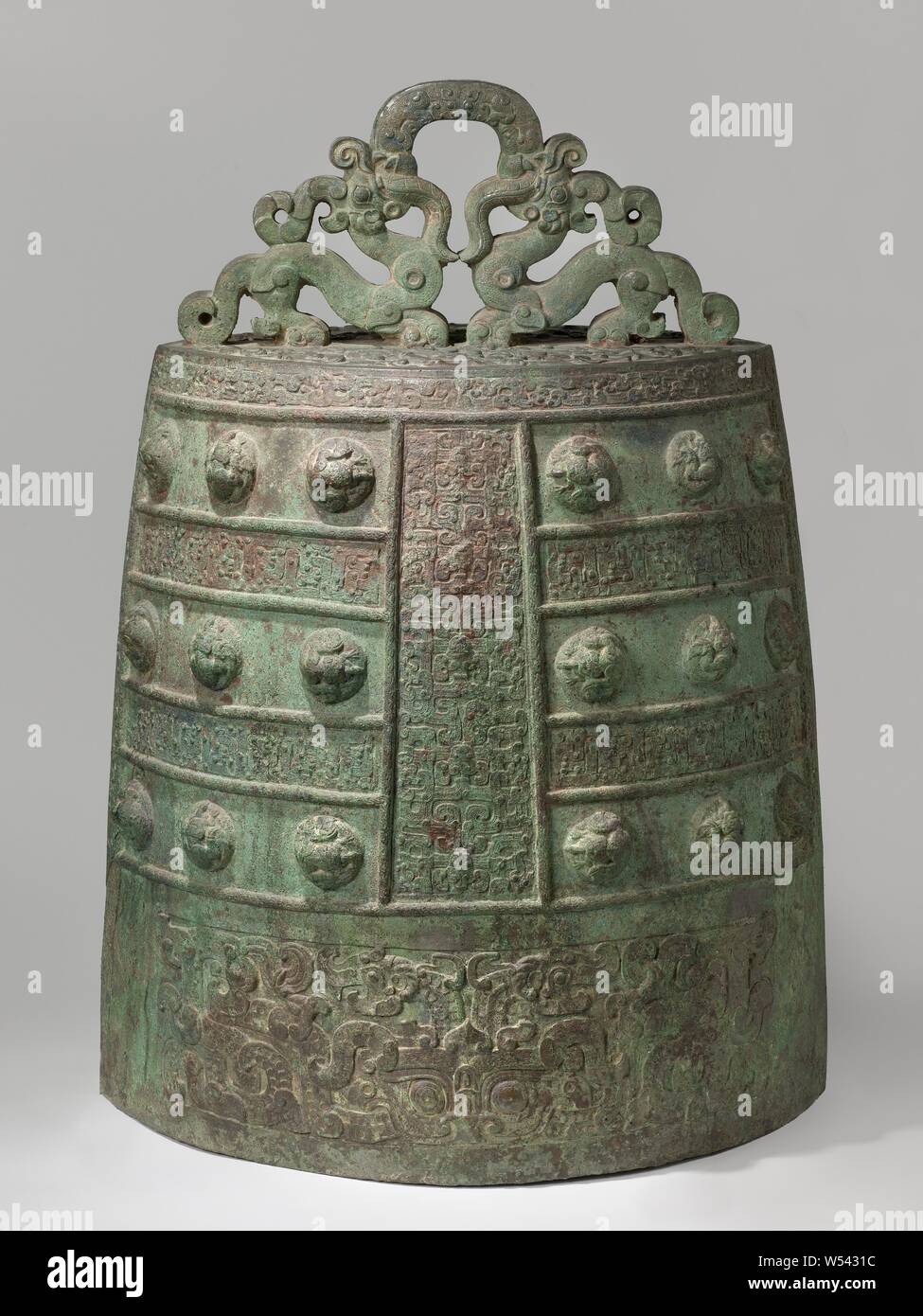 Ritual bell, Bronze bell decorated with embossed bands and buttons ...