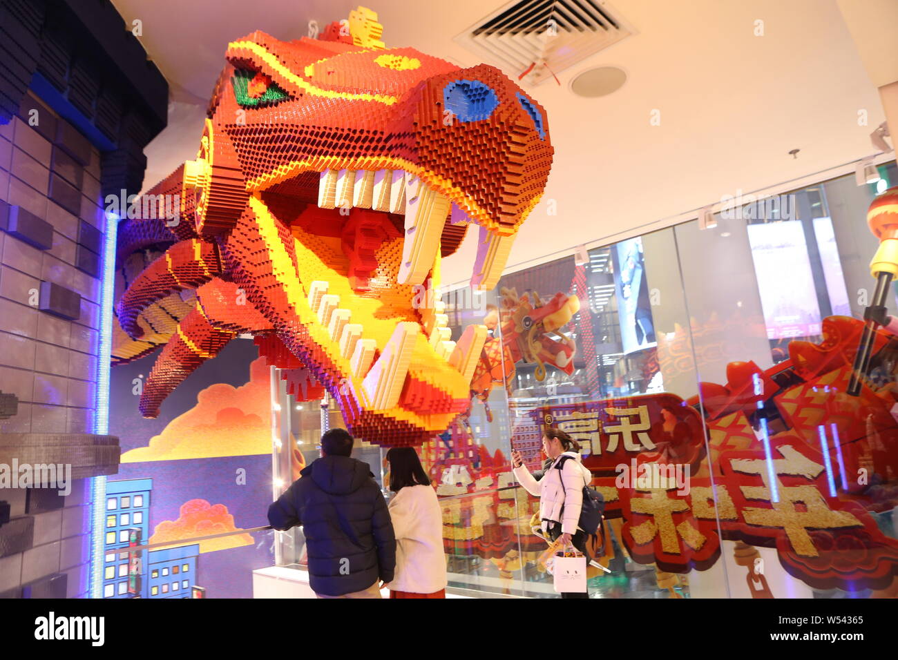 A model of a Chinese dragon spiralling up a pillar, constructed with ...