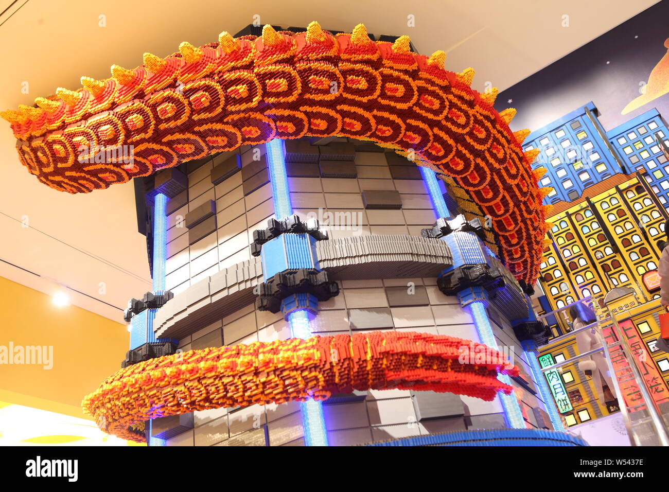 A model of a Chinese dragon spiralling up a pillar, constructed with ...
