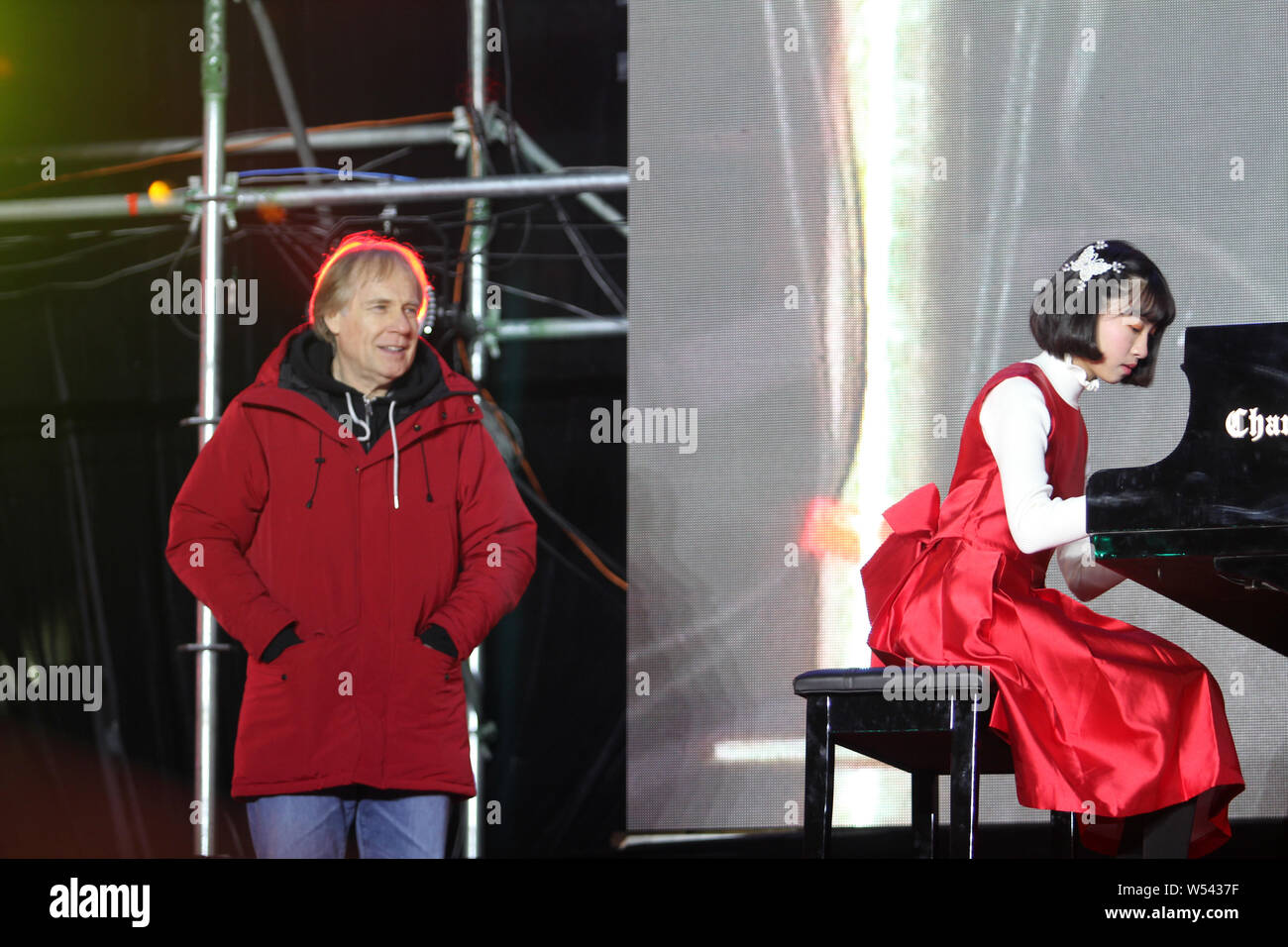 French pianist Richard Clayderman, left, attends a music event in Wuhan ...