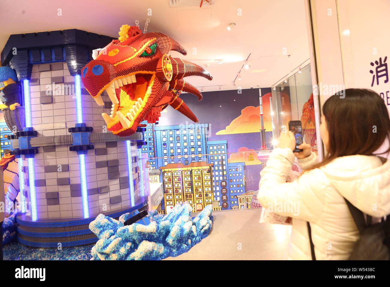 A model of a Chinese dragon spiralling up a pillar, constructed with ...