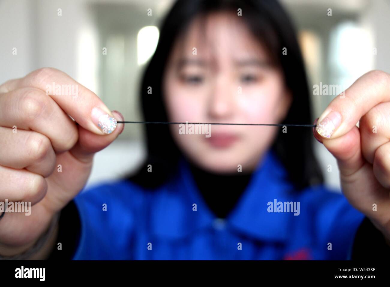 A Chinese worker shows China's first far infrared conductive heating ...