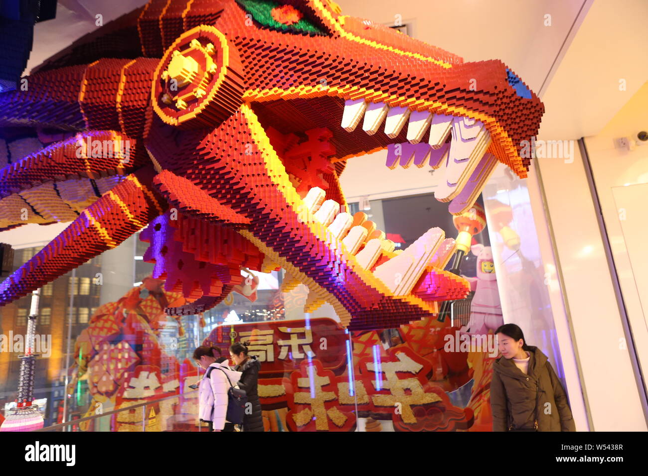 A model of a Chinese dragon spiralling up a pillar, constructed with ...
