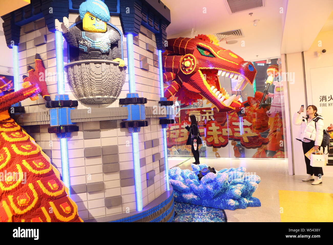 A model of a Chinese dragon spiralling up a pillar, constructed with ...