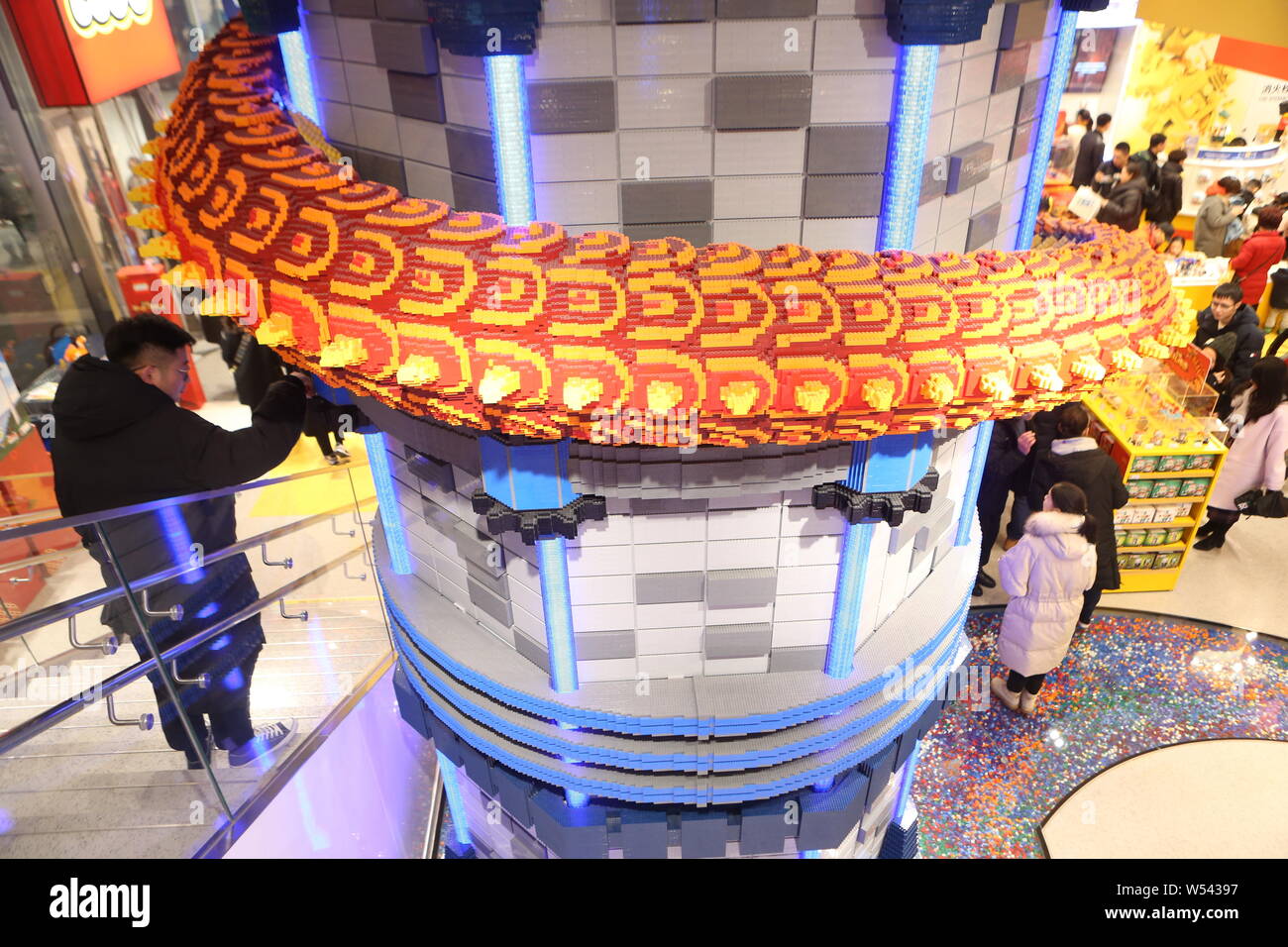 A model of a Chinese dragon spiralling up a pillar, constructed with ...