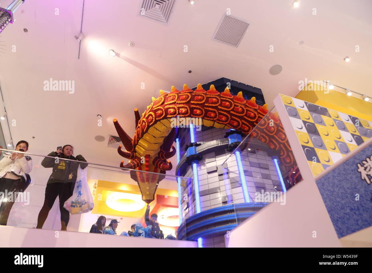 A model of a Chinese dragon spiralling up a pillar, constructed with ...