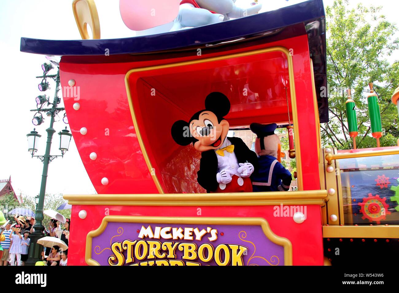 --FILE--An entertainer dressed in a Mickey Mouse costume performs ...