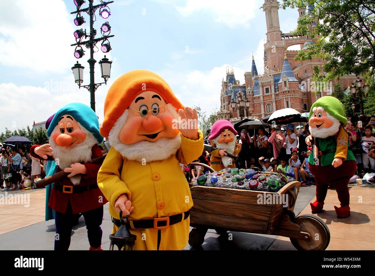 --FILE--Entertainer dressed in Seven Dwarfs costumes perform during a parade in the Shanghai ...