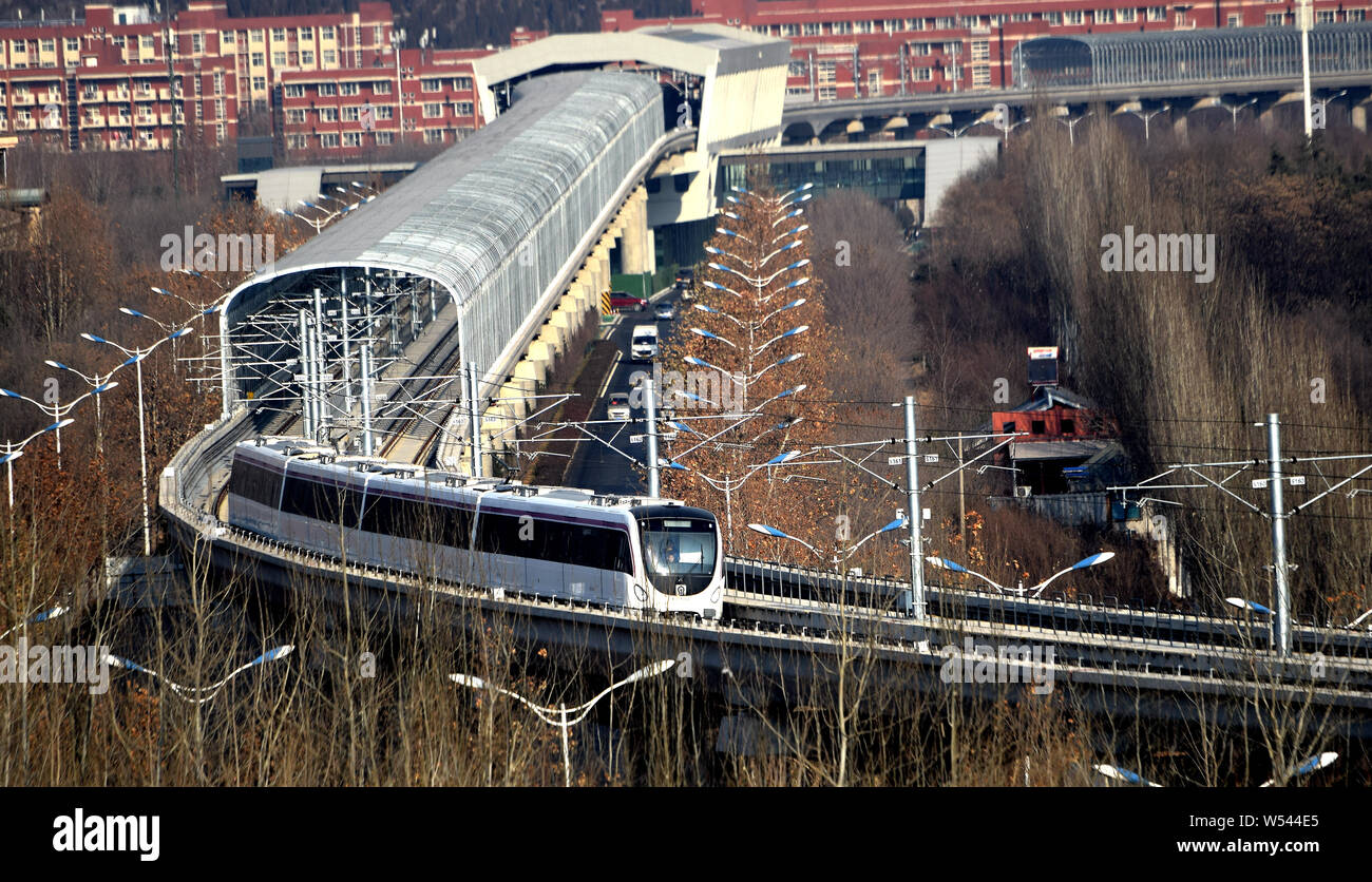 A subway train operates on Jinan's first metro line in Ji'nan city ...