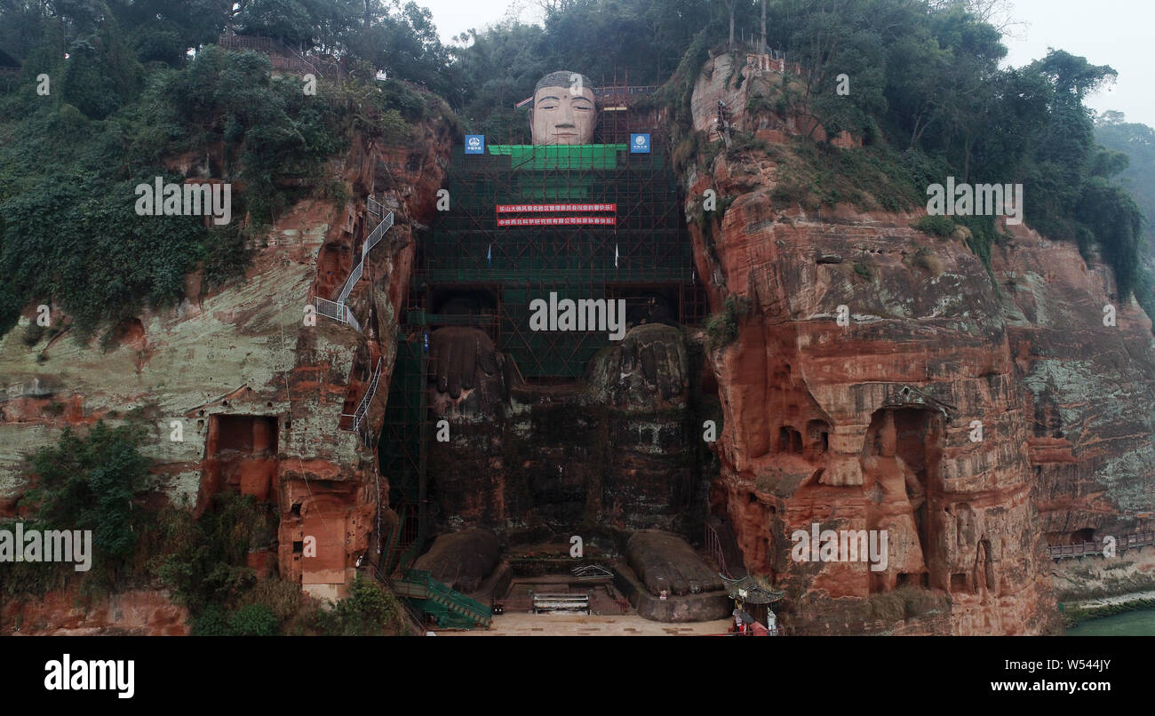 The Leshan Giant Buddha is covered with scaffolding for a restoration ...