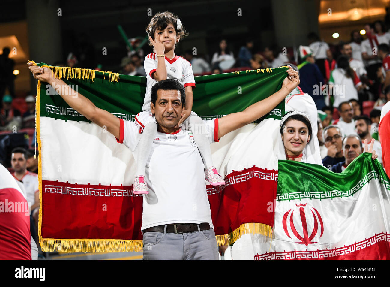 Iran fans wave slogans and national flags to show support to Iran ...