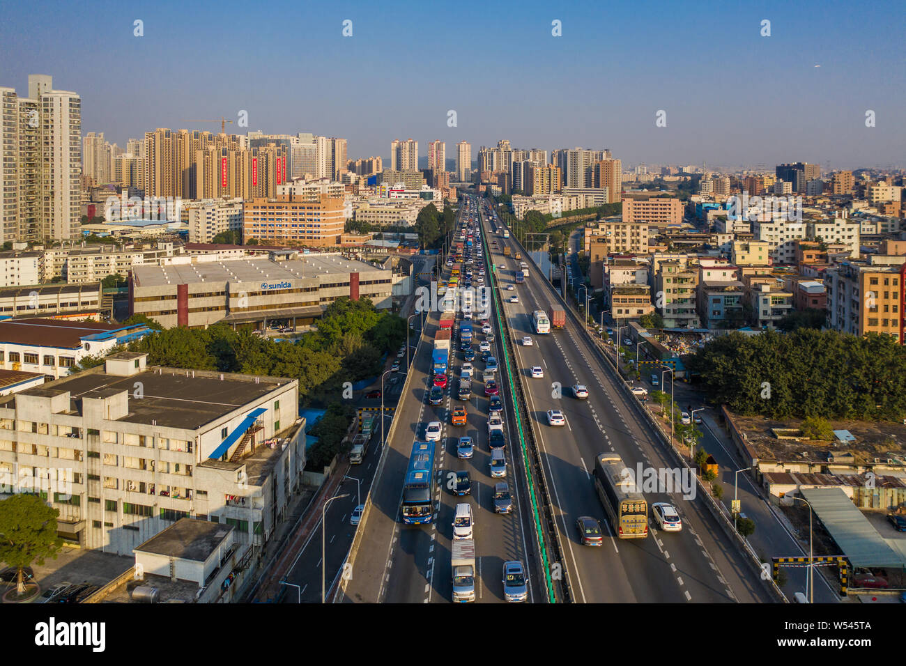 A large number of vehicles move slowly during a traffic jam during the ...