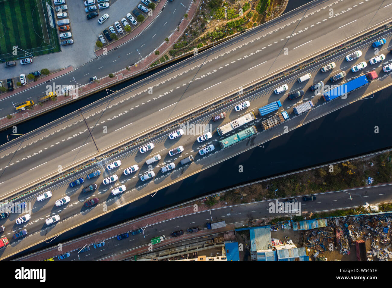 A large number of vehicles move slowly during a traffic jam during the ...