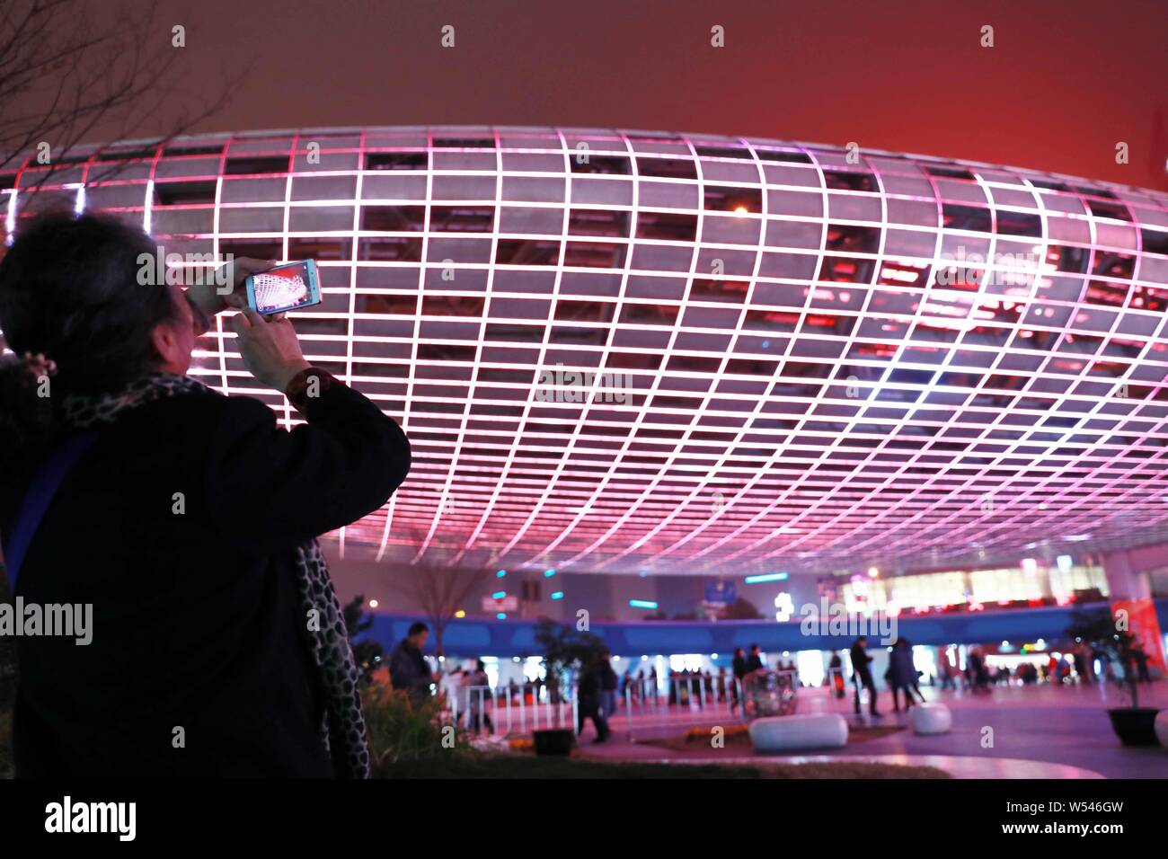The giant egg-shaped structure is illuminated by colorful lights at an ...