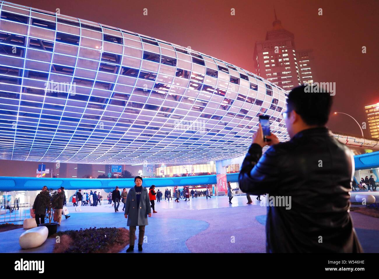 The giant egg-shaped structure is illuminated by colorful lights at an ...