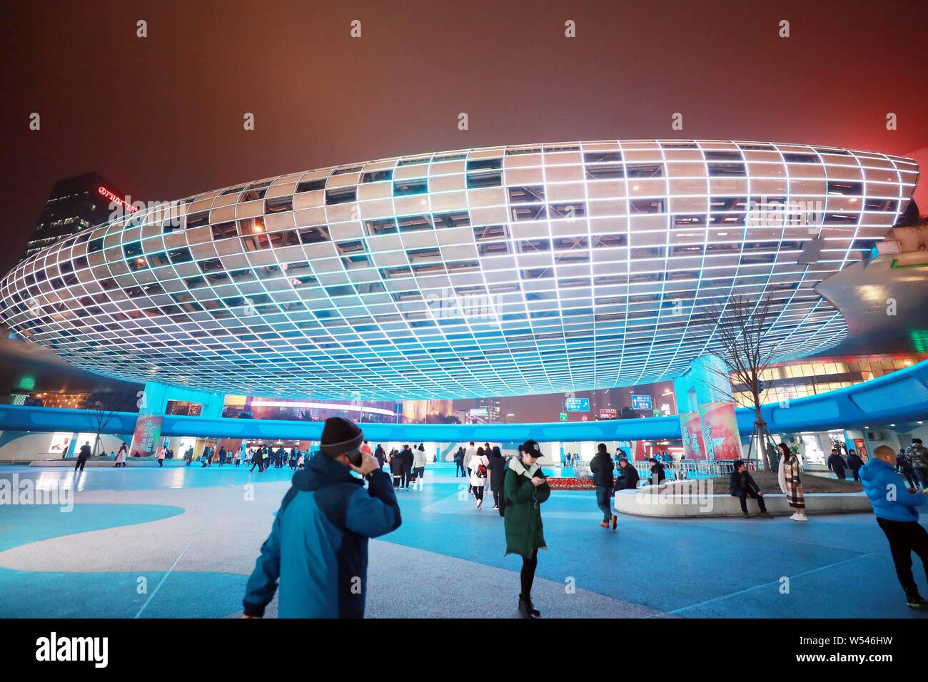 The giant egg-shaped structure is illuminated by colorful lights at an ...