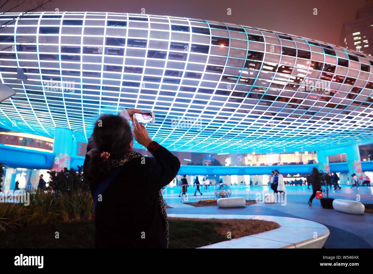 The giant egg-shaped structure is illuminated by colorful lights at an ...