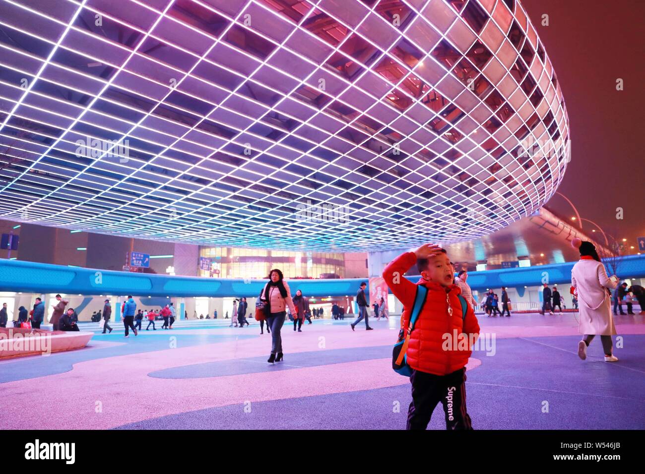 The giant egg-shaped structure is illuminated by colorful lights at an ...