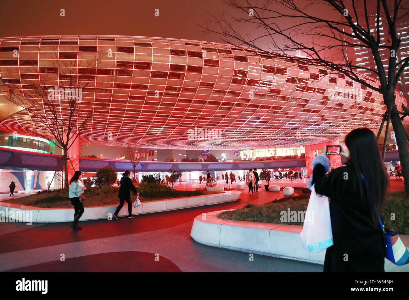 The giant egg-shaped structure is illuminated by colorful lights at an ...