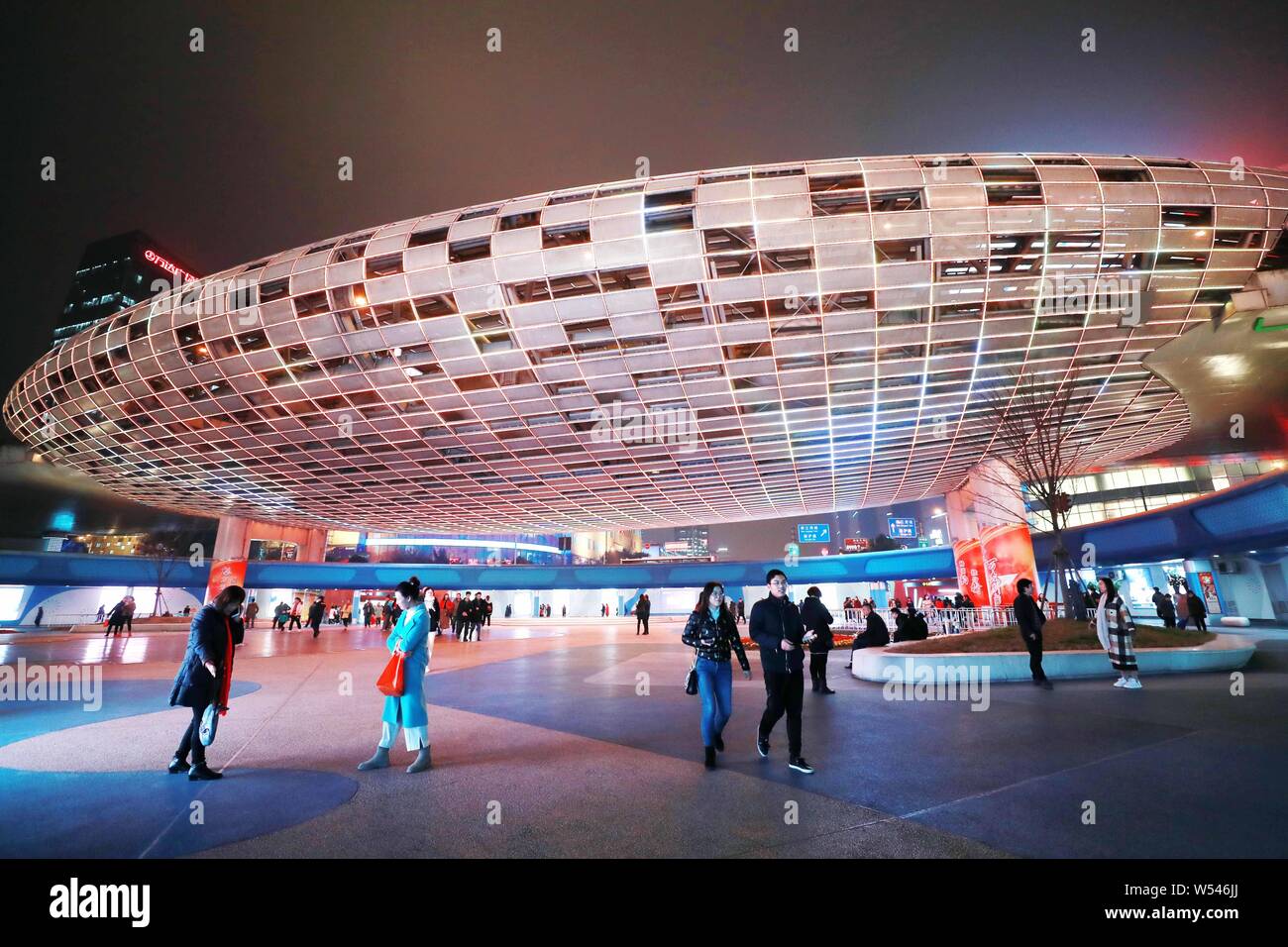 The giant egg-shaped structure is illuminated by colorful lights at an ...