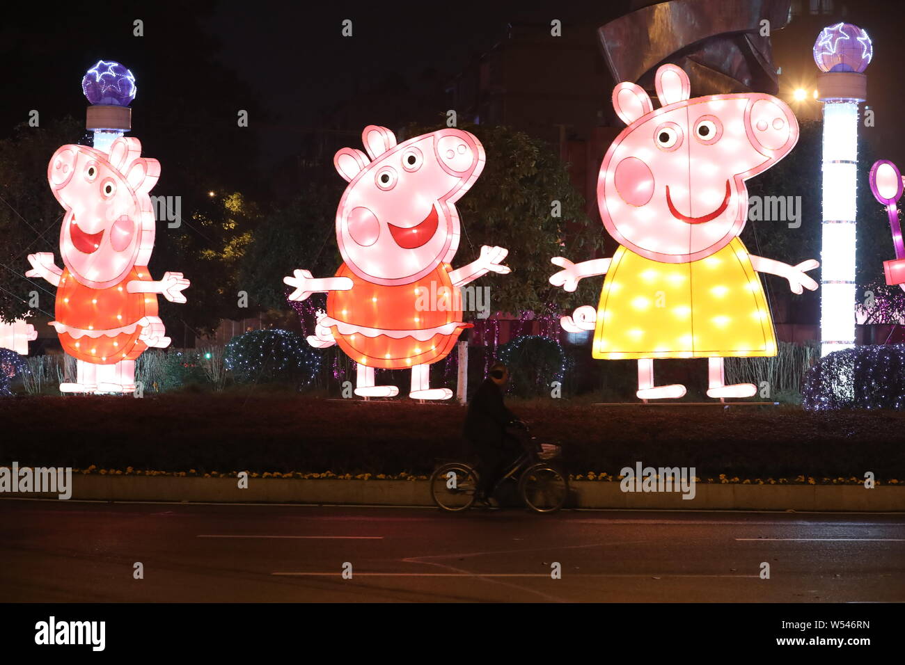 Colorful and illuminated lanterns featuring shaped of Peppa Pig are ...