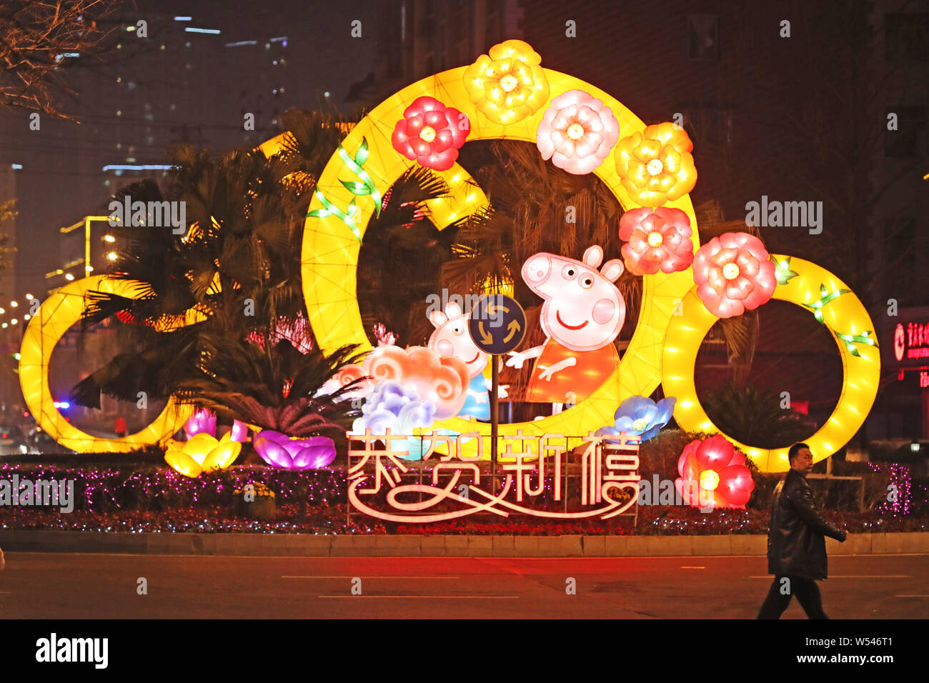 Colorful and illuminated lanterns featuring shaped of Peppa Pig are ...