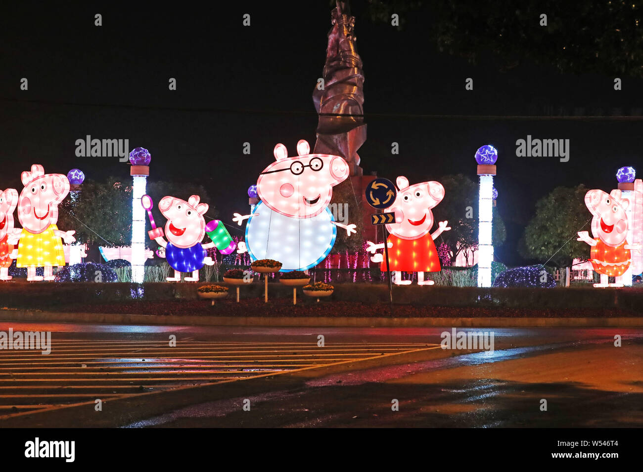 Colorful and illuminated lanterns featuring shaped of Peppa Pig are ...