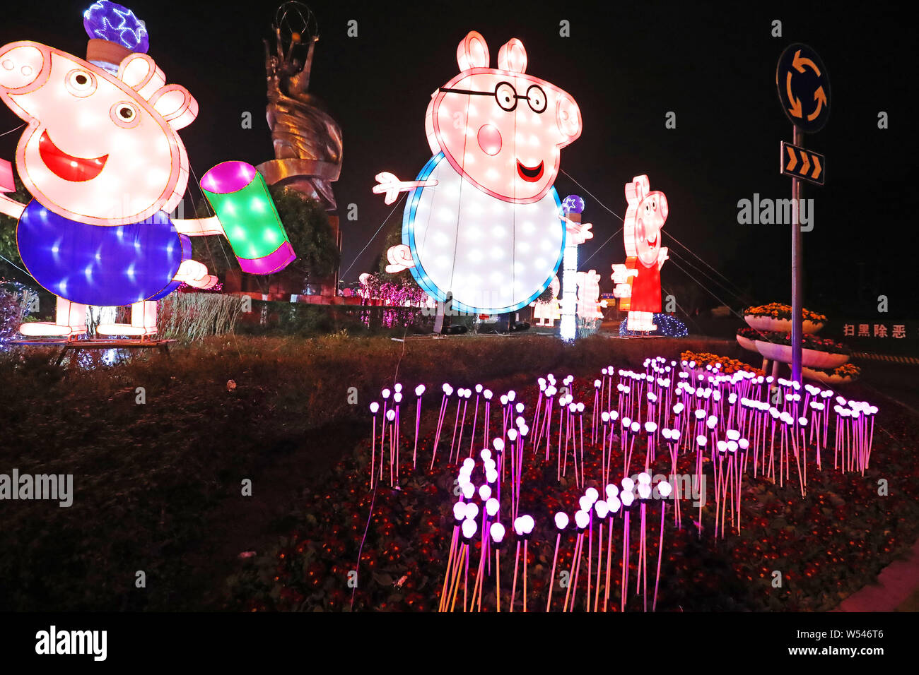 Colorful and illuminated lanterns featuring shaped of Peppa Pig are ...