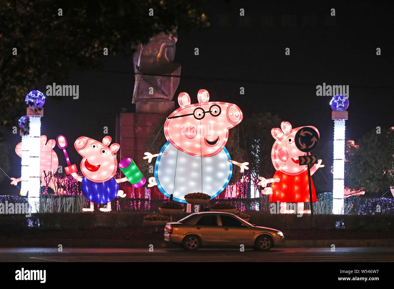 Colorful and illuminated lanterns featuring shaped of Peppa Pig are ...