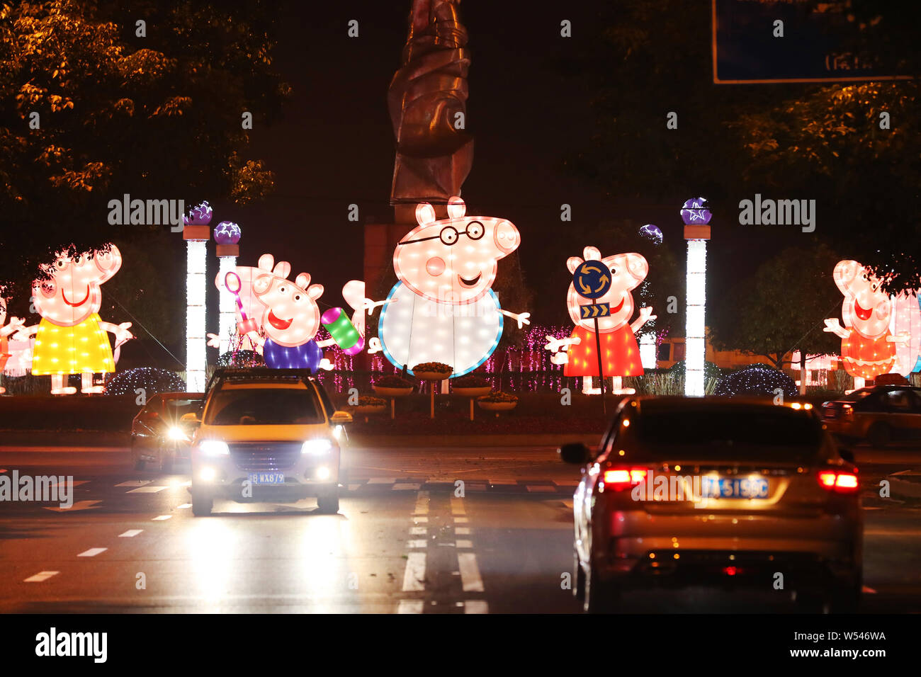 Colorful and illuminated lanterns featuring shaped of Peppa Pig are ...