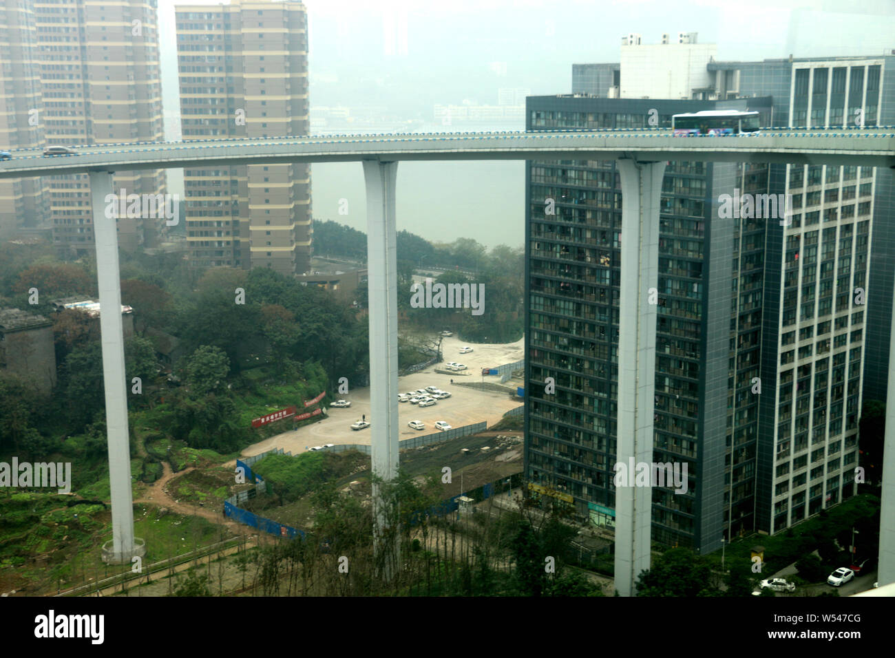 Cars drive on China's tallest highway interchange, Sujiaba Interchange ...