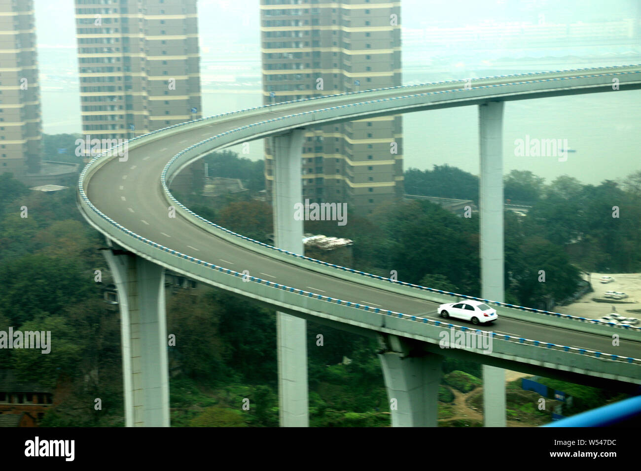 Cars drive on China's tallest highway interchange, Sujiaba Interchange ...