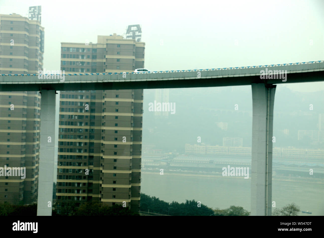 Cars drive on China's tallest highway interchange, Sujiaba Interchange ...