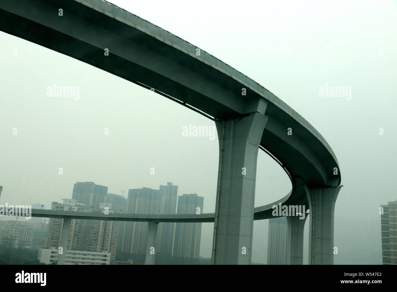 Cars drive on China's tallest highway interchange, Sujiaba Interchange ...