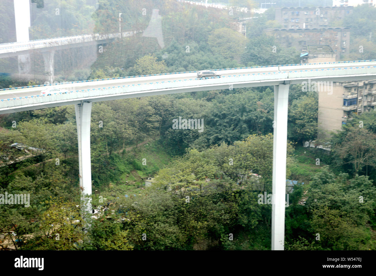 Cars drive on China's tallest highway interchange, Sujiaba Interchange ...