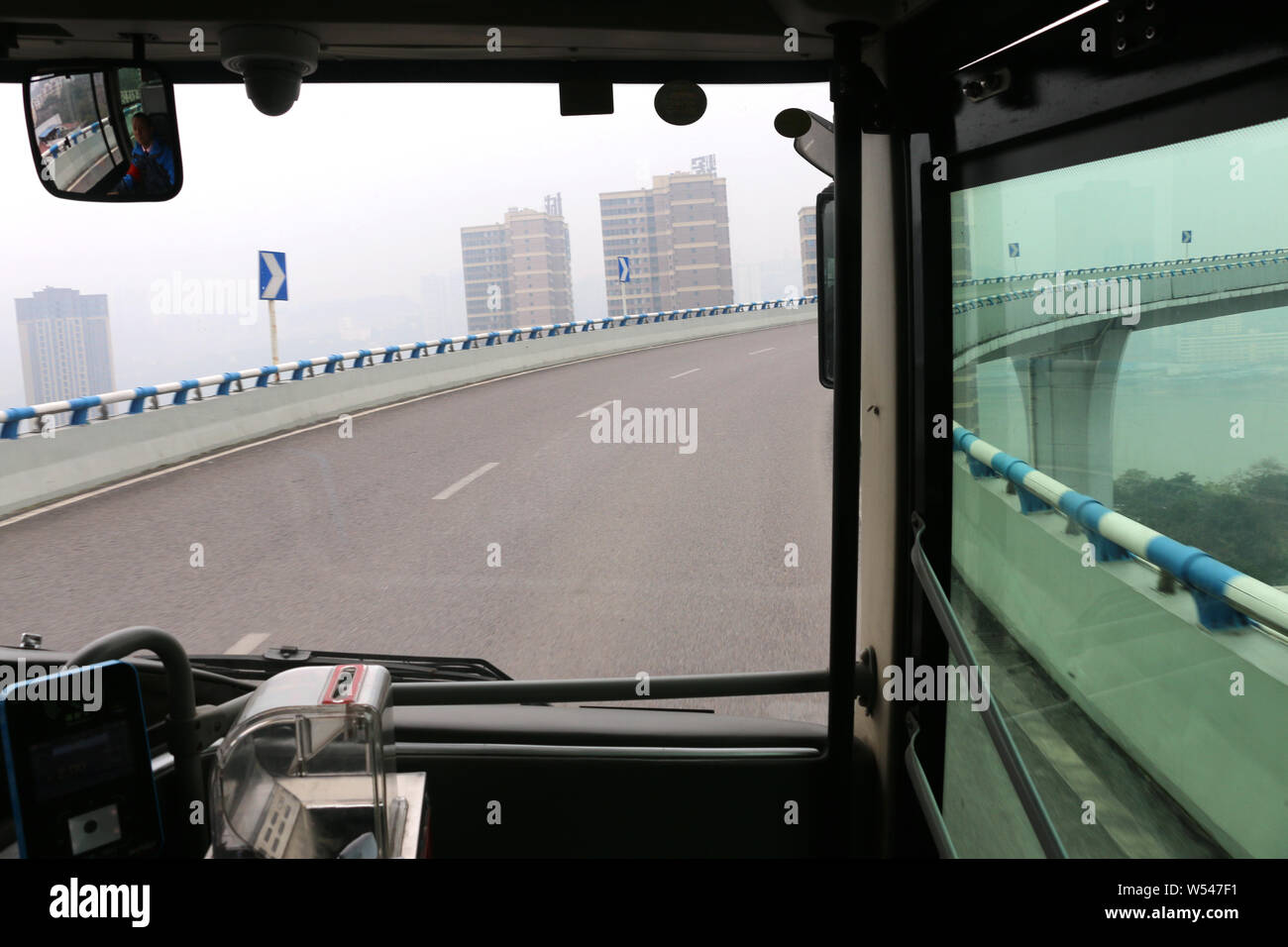 A bus drives on China's tallest highway interchange, Sujiaba ...