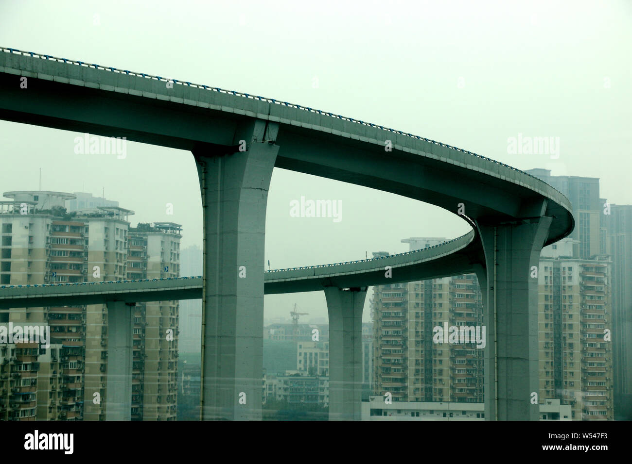 Cars drive on China's tallest highway interchange, Sujiaba Interchange ...