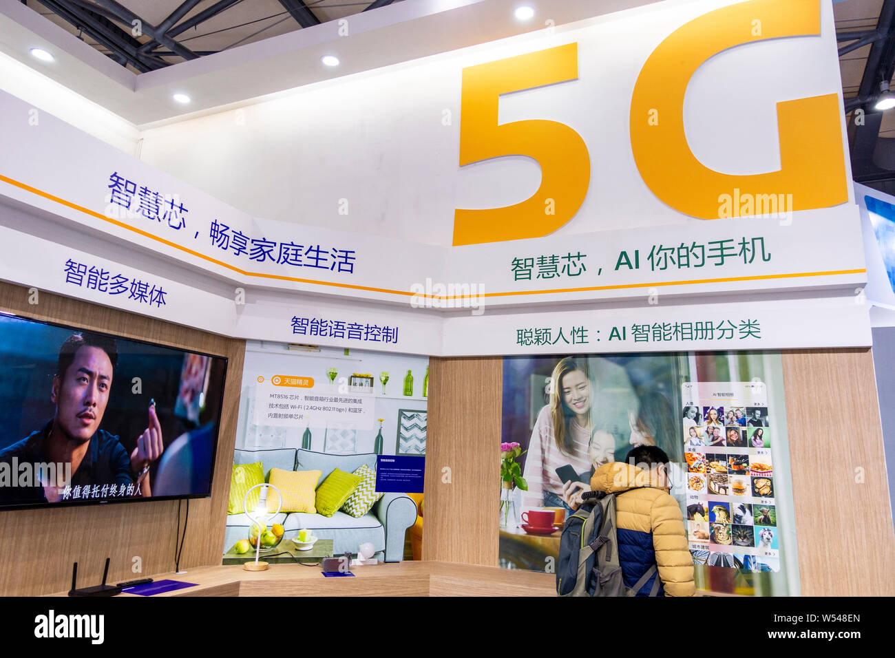 --FILE--A visitor is seen at the stand of MediaTek.Inc with a logo of ...