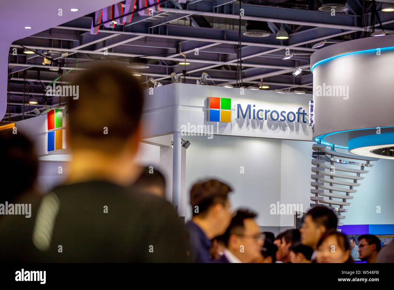 --FILE--People visit the stand of Microsoft during the 2018 China ...