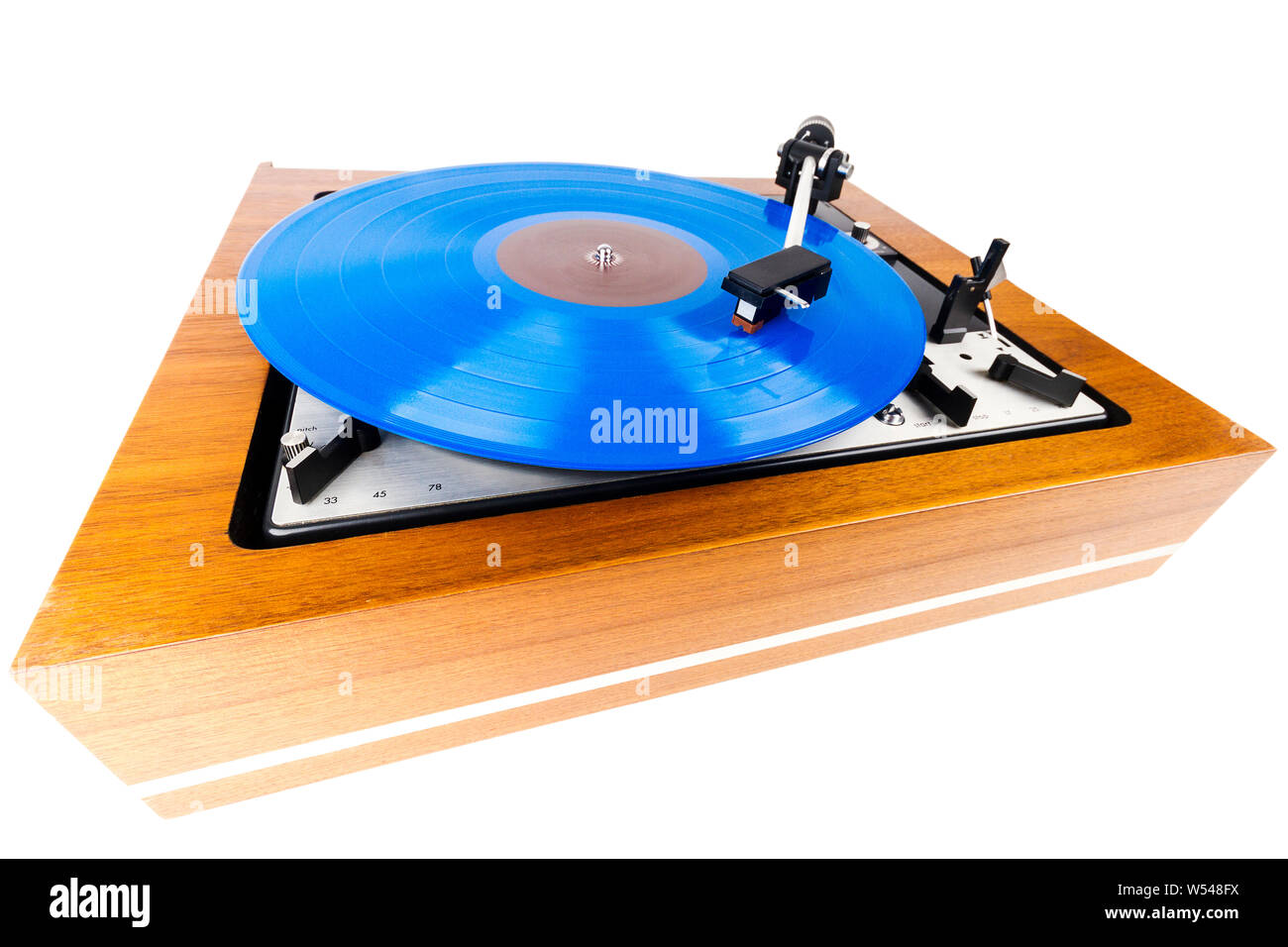 Vintage turntable with a blue vinyl isolated on white. Wooden plinth ...