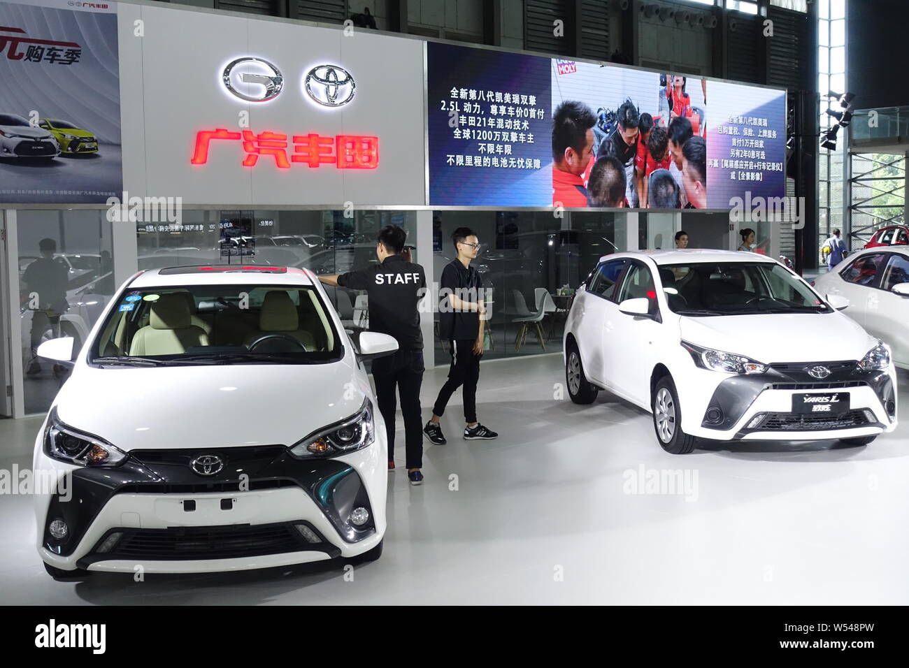 --FILE--People visit the stand of GAC Toyota, a joint venture between ... --FILE--People visit the stand of GAC Toyota, a joint venture between ...